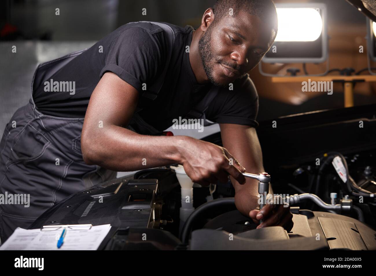 Adult man checking under the hood of car hi-res stock photography and images - Alamy