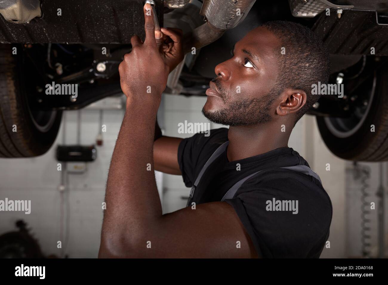 repairing in action. hardworking guy employee in uniform works in the ...