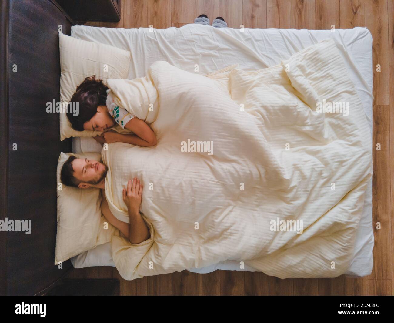 overhead top view of couple in bed Stock Photo - Alamy