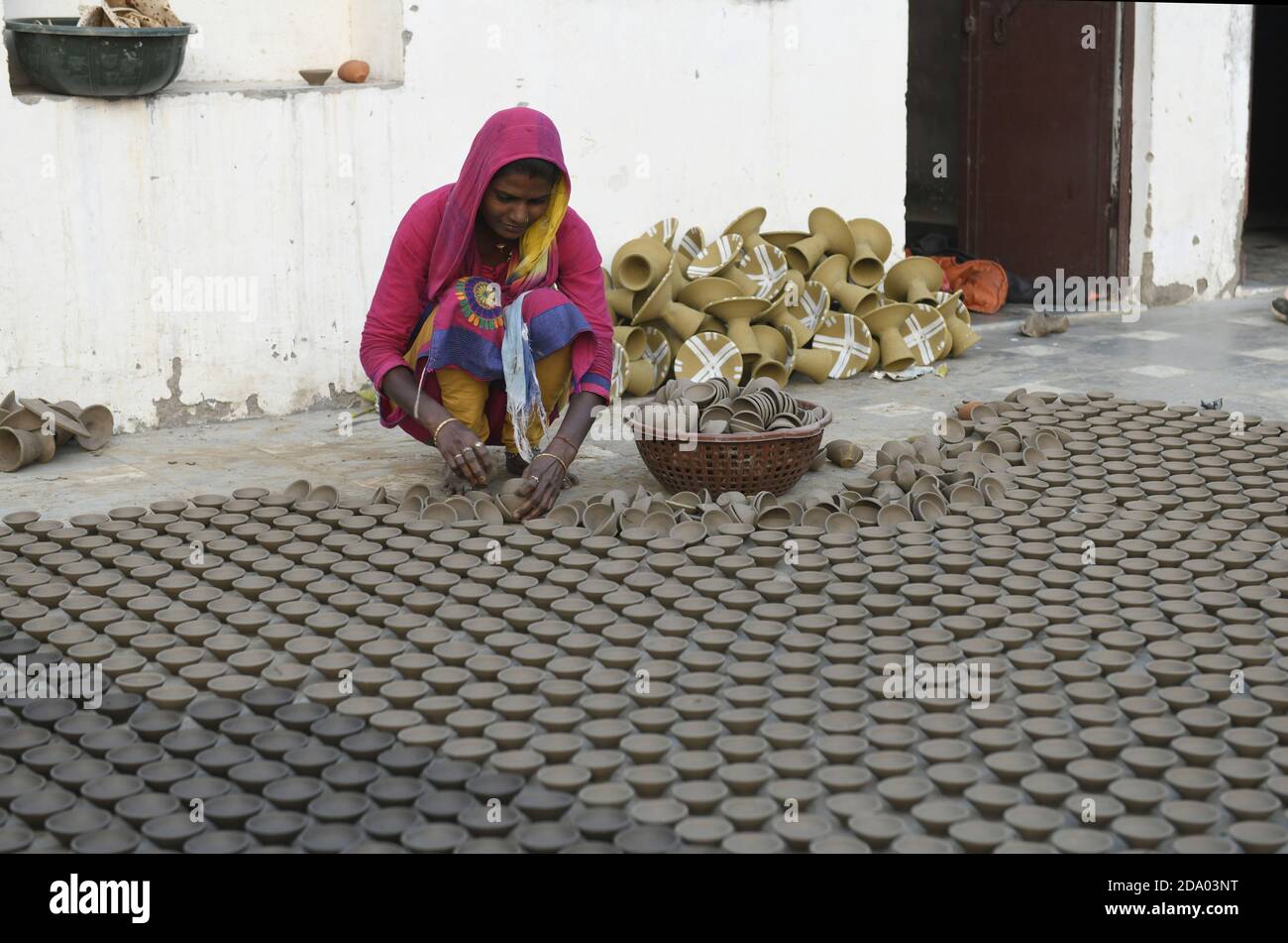Beawar, Rajasthan, India, Nov. 8, 2020: A potter prepares diyas or ...