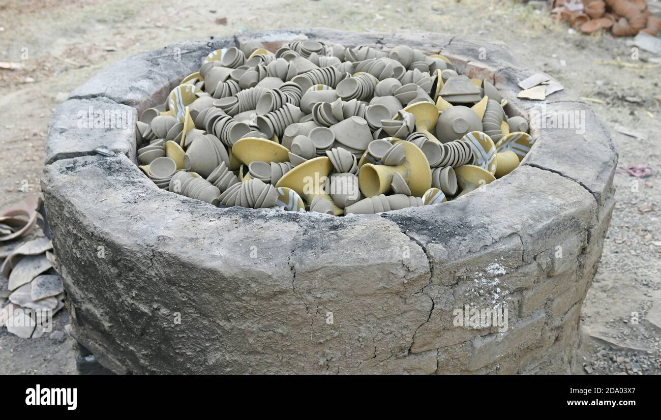 Beawar, Rajasthan, India, Nov. 8, 2020: An indian potter prepares diyas ...