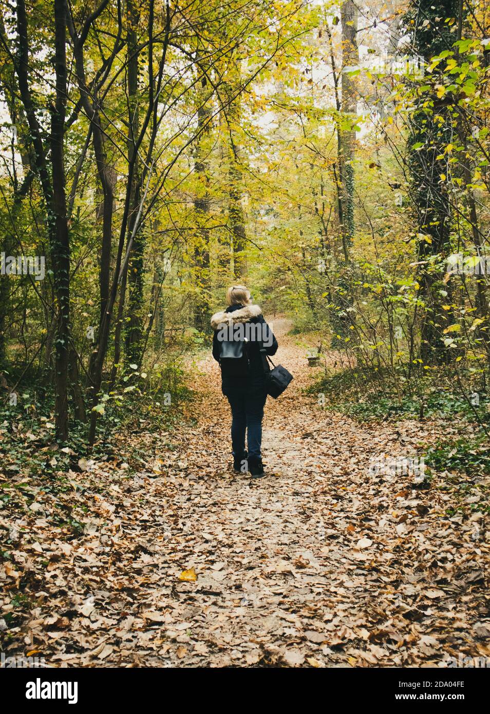 Photography of a girl walking in distance Stock Photo - Alamy