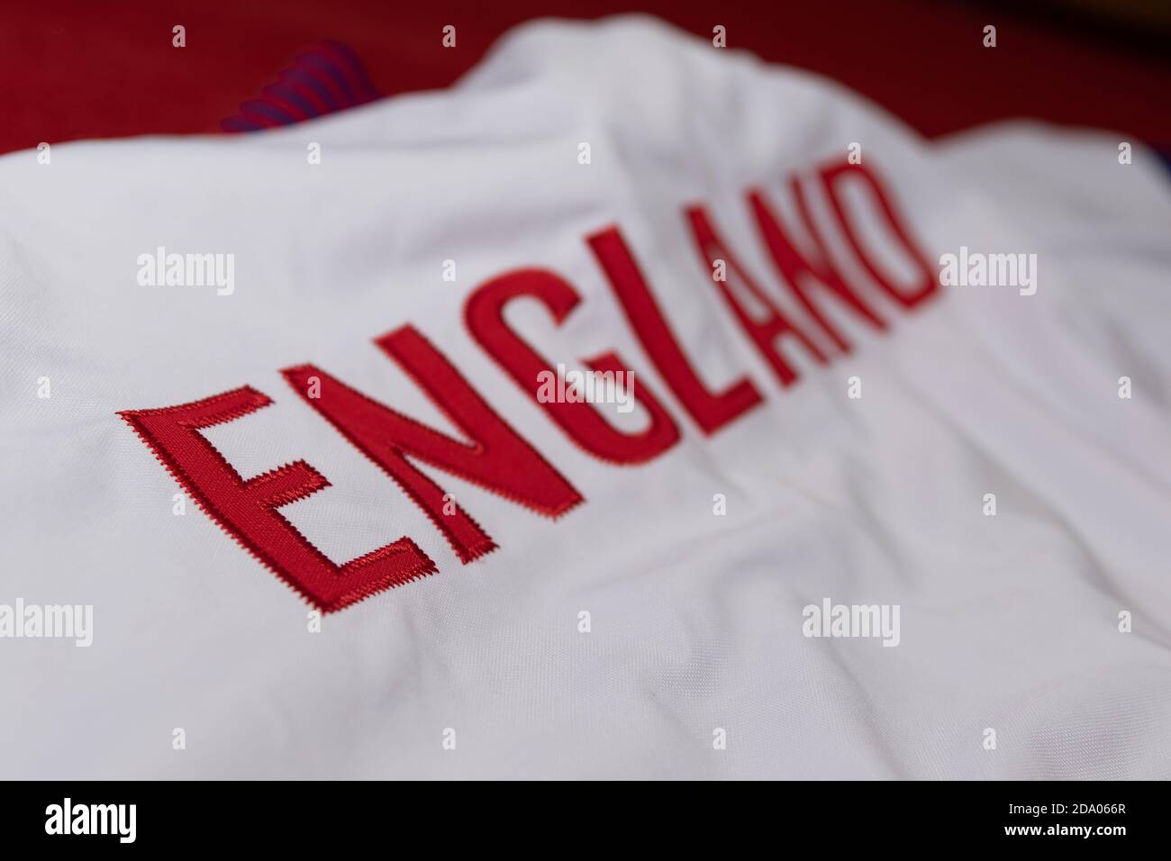 Large Red ENGLAND text on the back of a sports jacket Stock Photo - Alamy