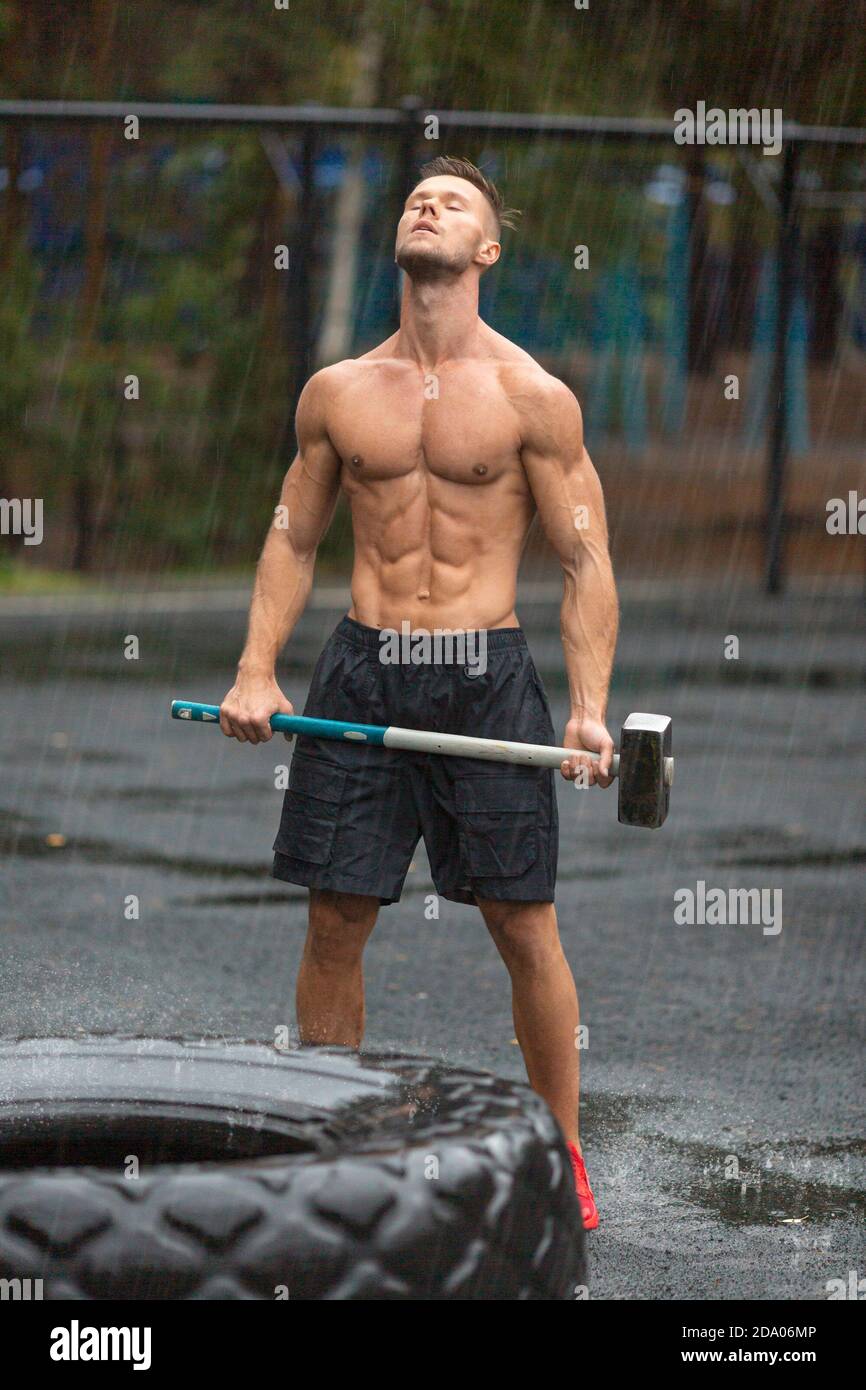Portrait of a sportsman having rest after hard workout outdoor in a ...