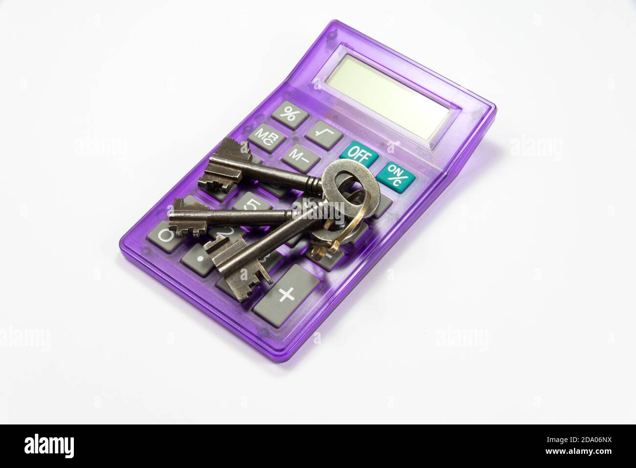 Calculator and house key Stock Photo - Alamy