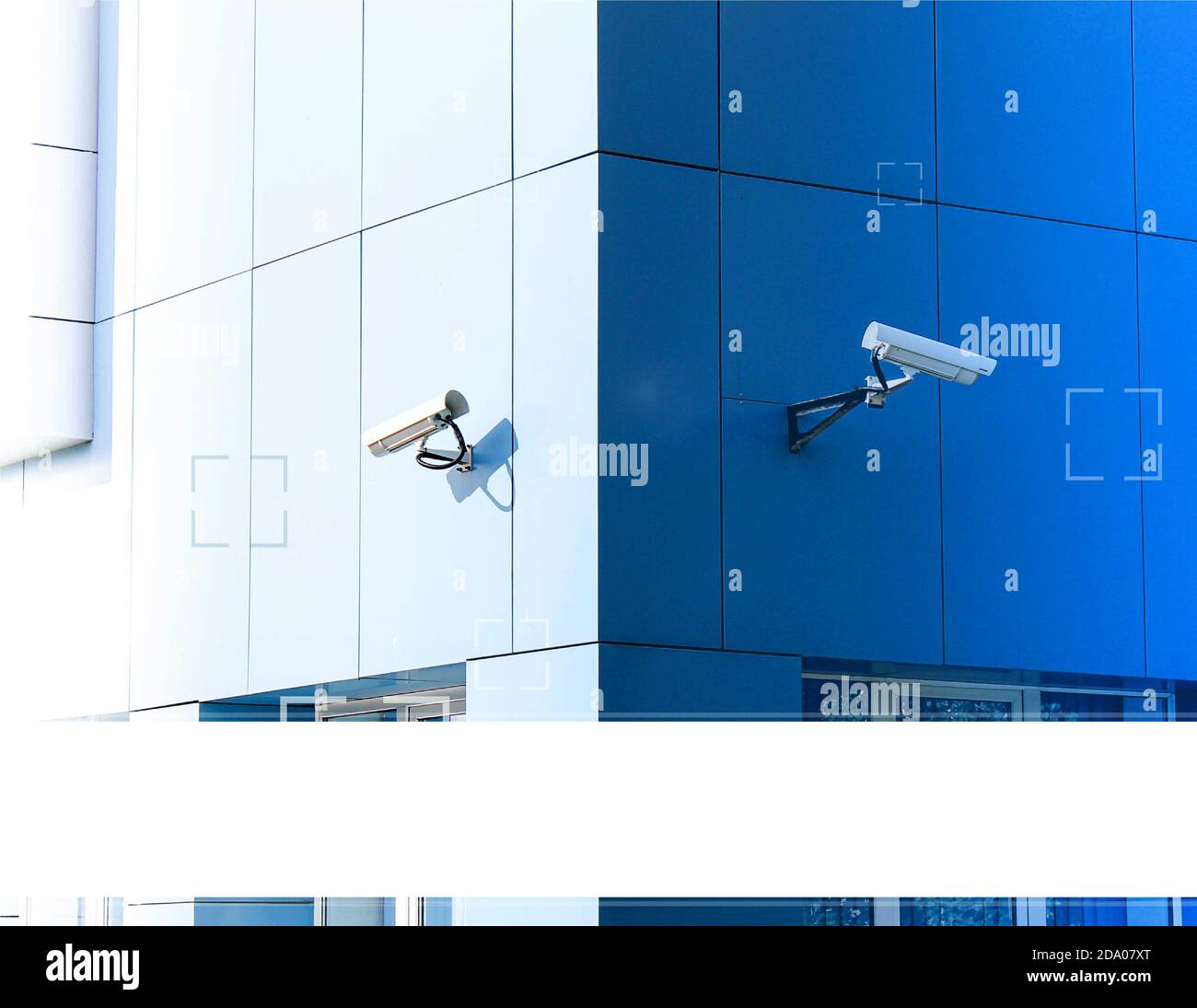 Two surveillance cameras on the building are deployed in opposite ...