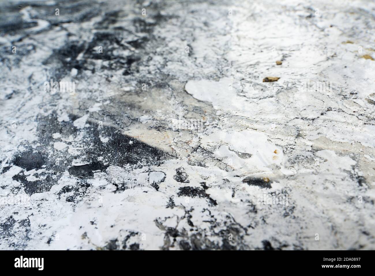 Sheet of paper damaged by chemical reaction. Corrosive acid-alkaline ...