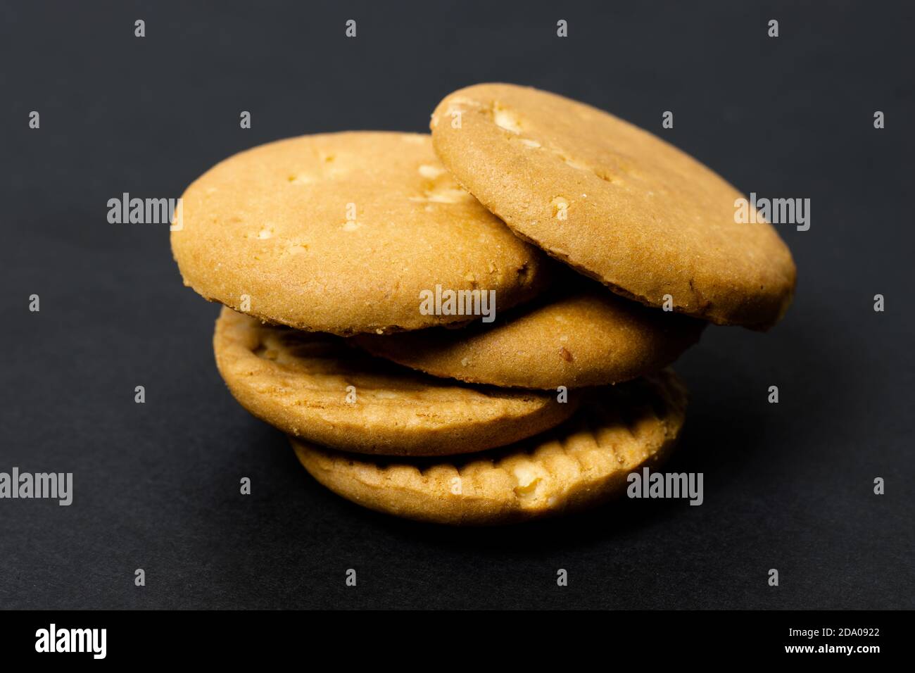 Delicious wheat crispy biscuits isolated on moody dark background Stock ...