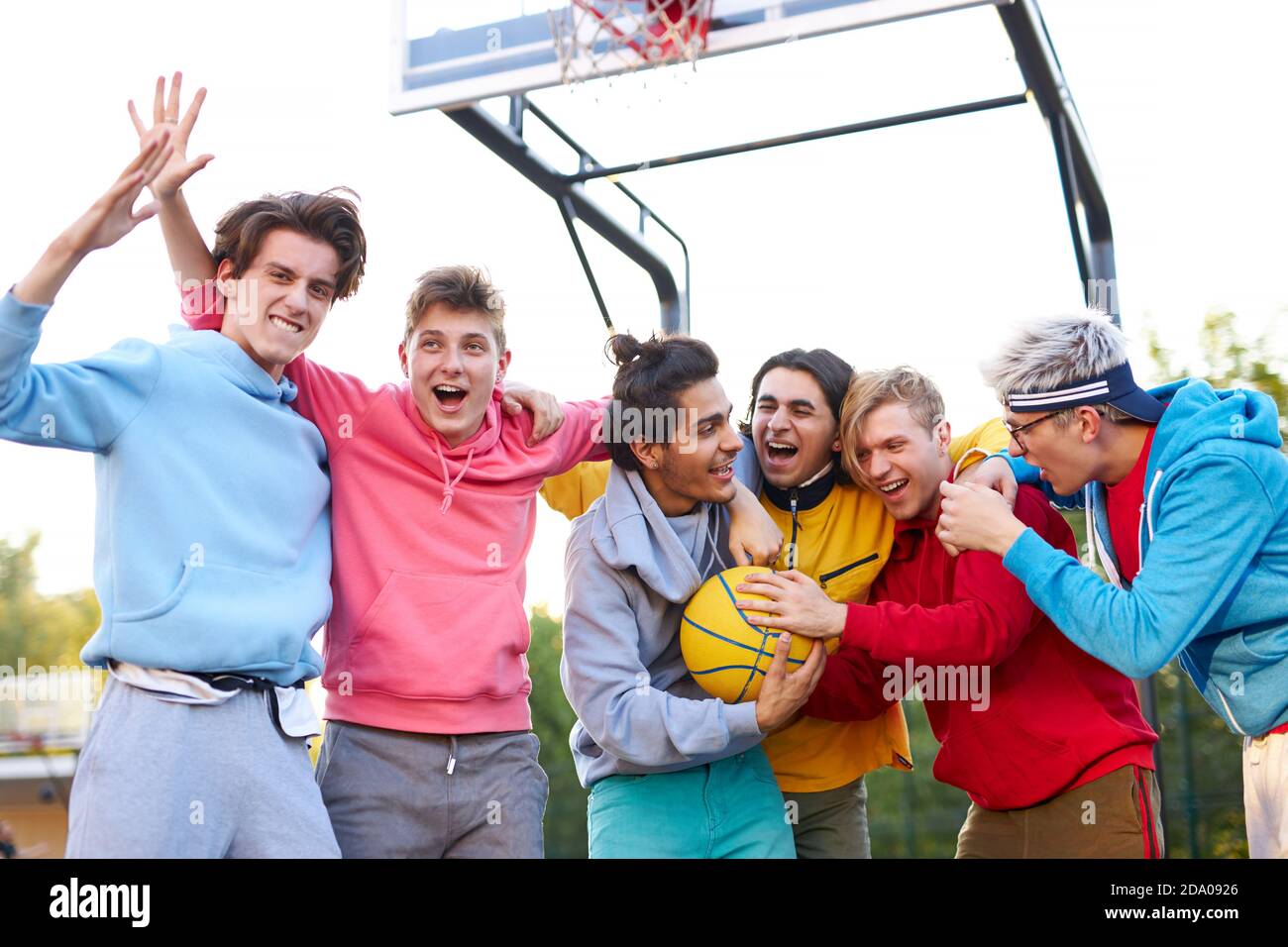 cheerful happy group of young guys celebrate their winning, caucasian ...