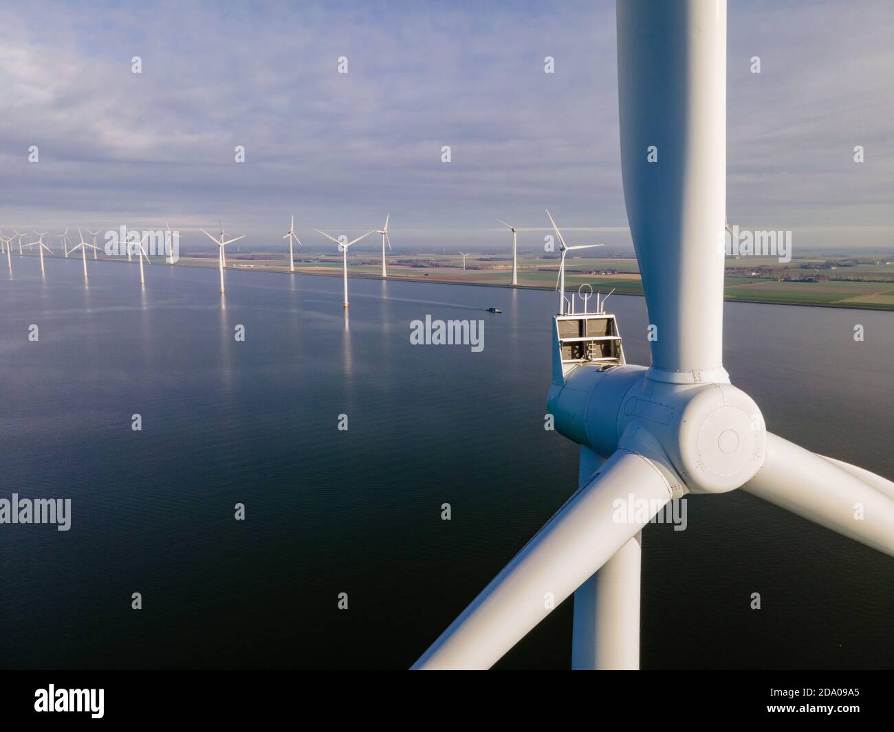 offshore windmill park with clouds and a blue sky, windmill park in the ...