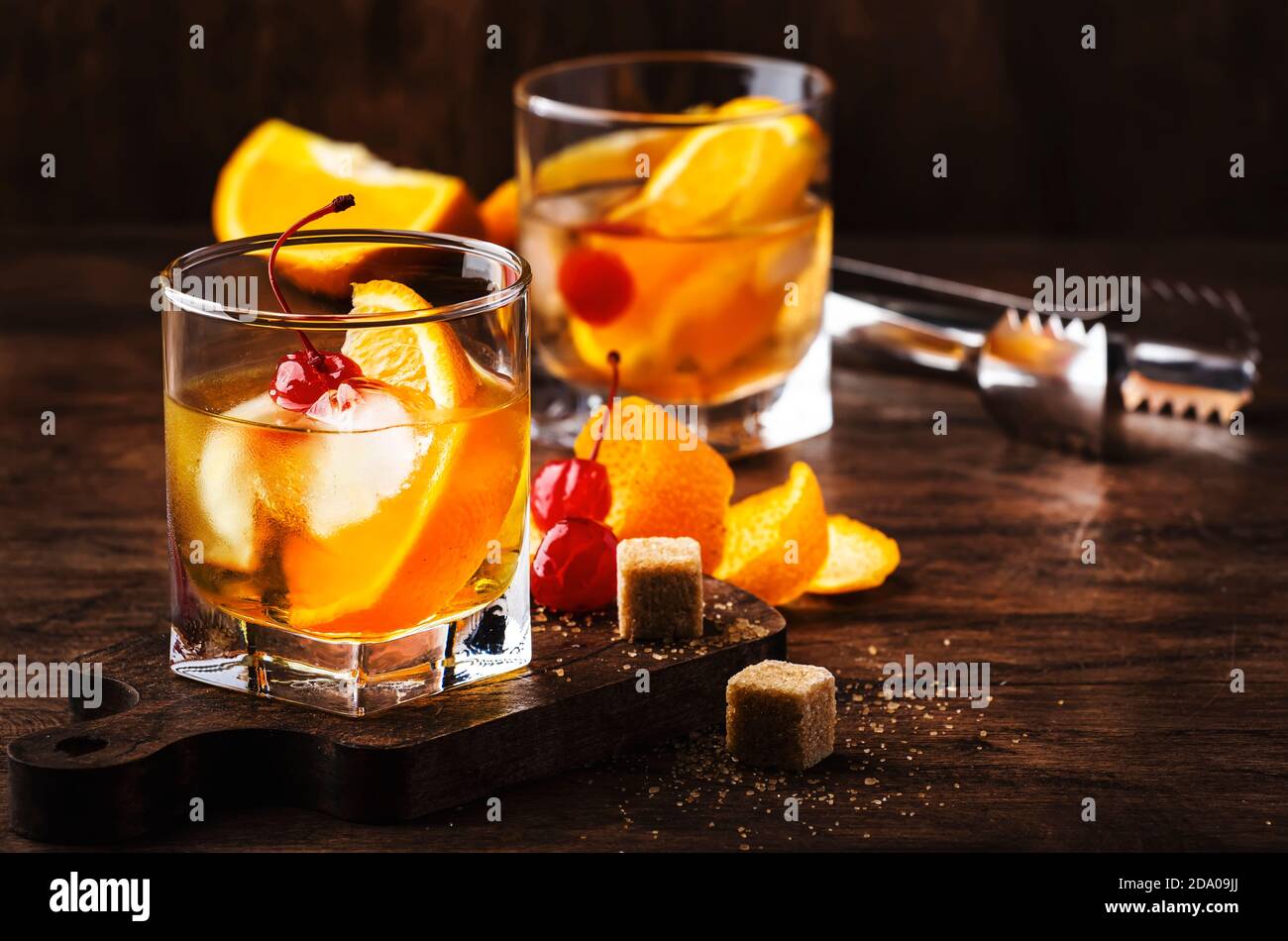 Old fashioned cocktail with bourbon, cane sugar, orange slice, cherry ...