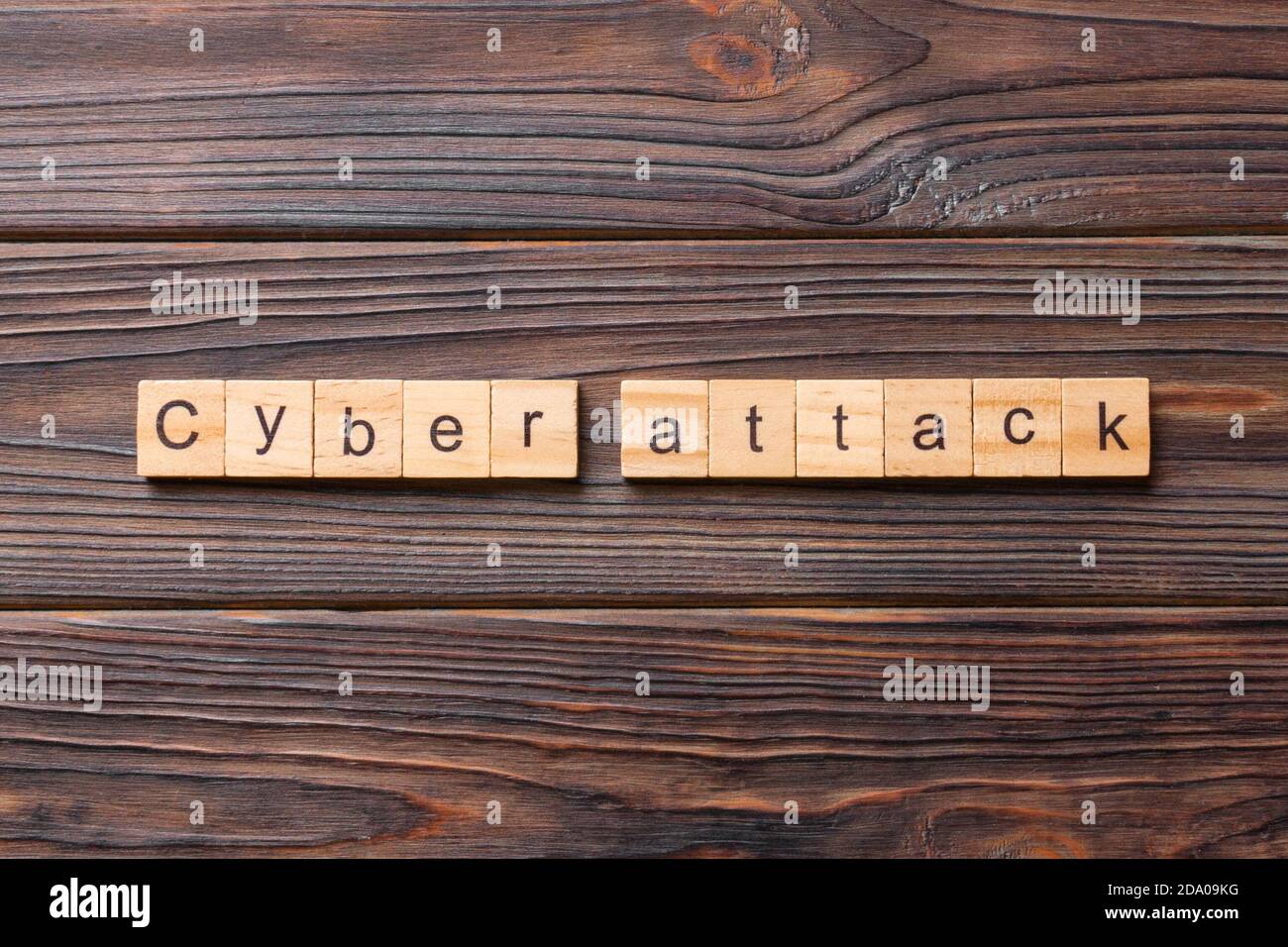 Cyber attack word written on wood block. Cyber attack text on cement ...