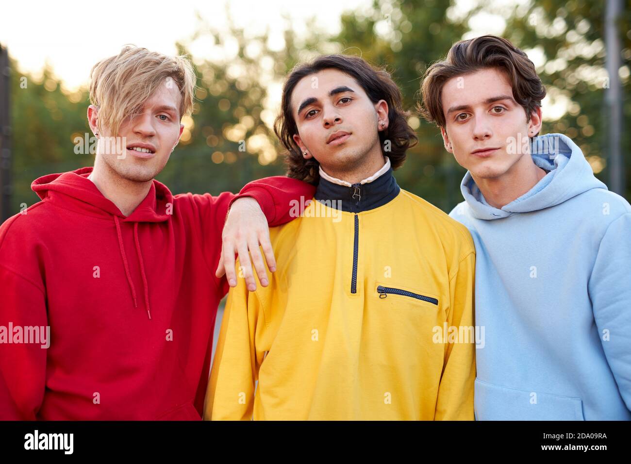 portrait of young stylish teenagers outdoors, caucasian boys in ...