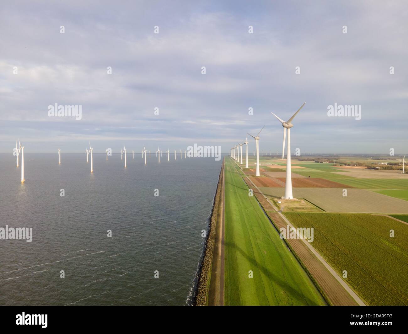offshore windmill park with clouds and a blue sky, windmill park in the ...