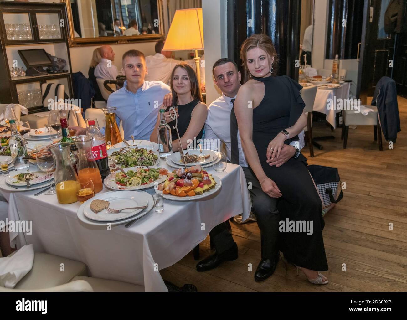 Group of friends out for dinner hi-res stock photography and images - Alamy