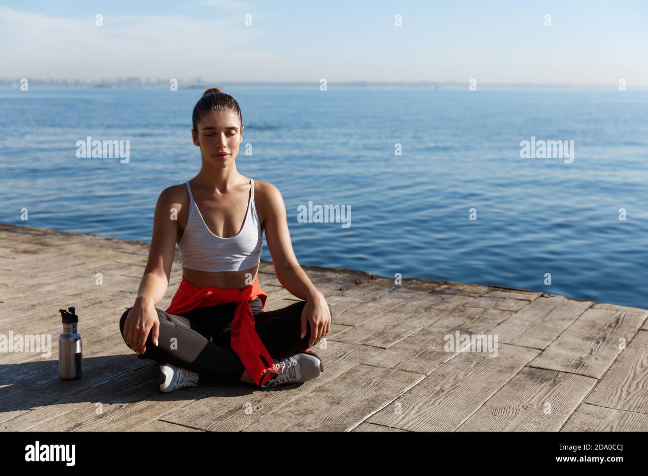 High angle shot of beautiful relaxed woman having yoga training near ...