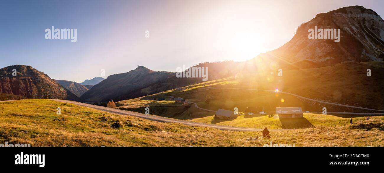 Beautiful scenic mountain scenery with huts and warm colors, sundown ...