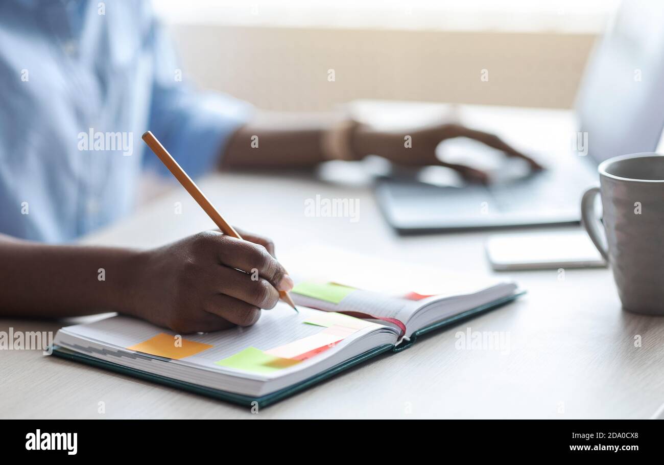 Busy Unrecognizable Woman Writing In Notepad, Taking Notes At Workplace ...