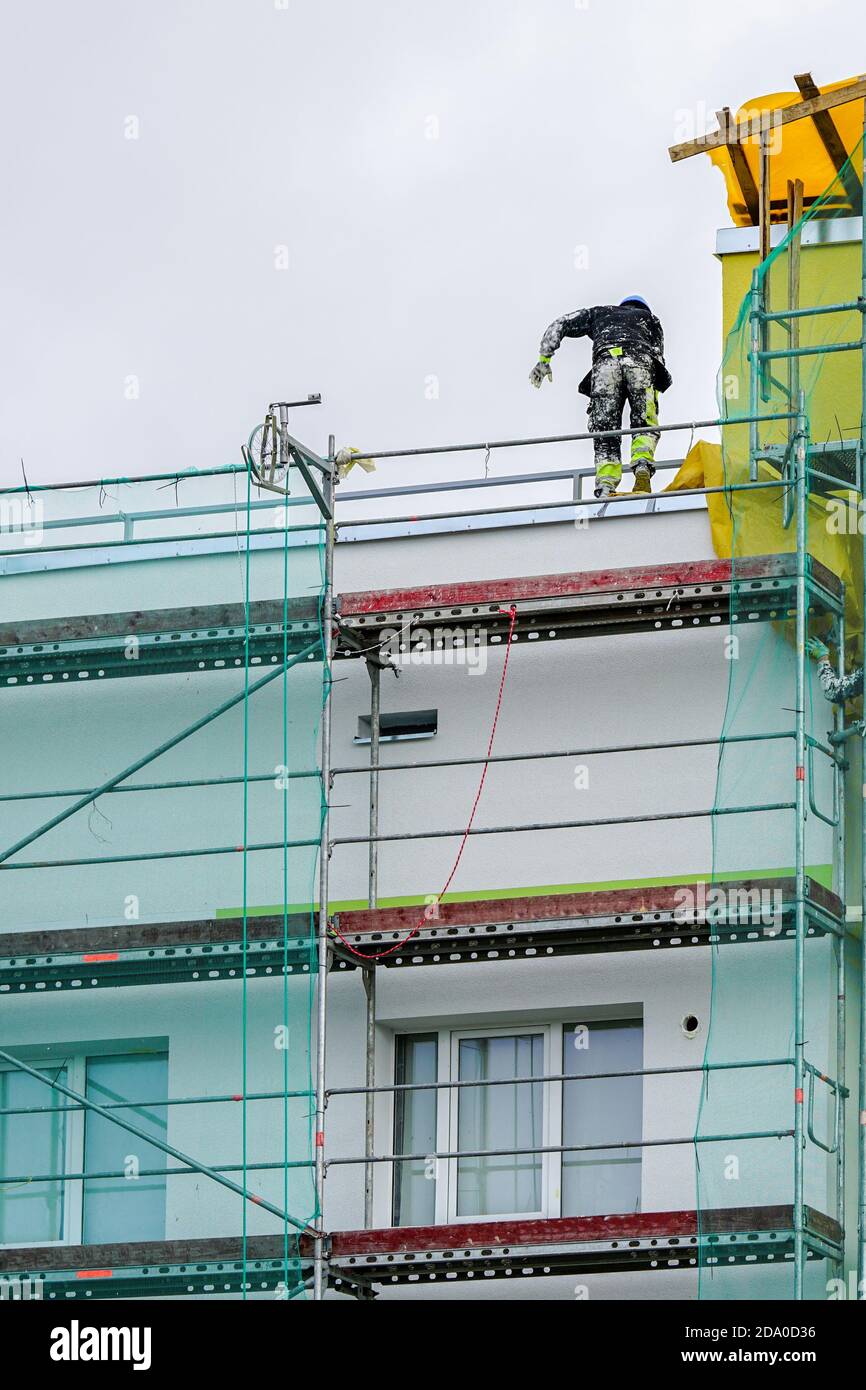 Worker performs dangerous activities hi-res stock photography and ...