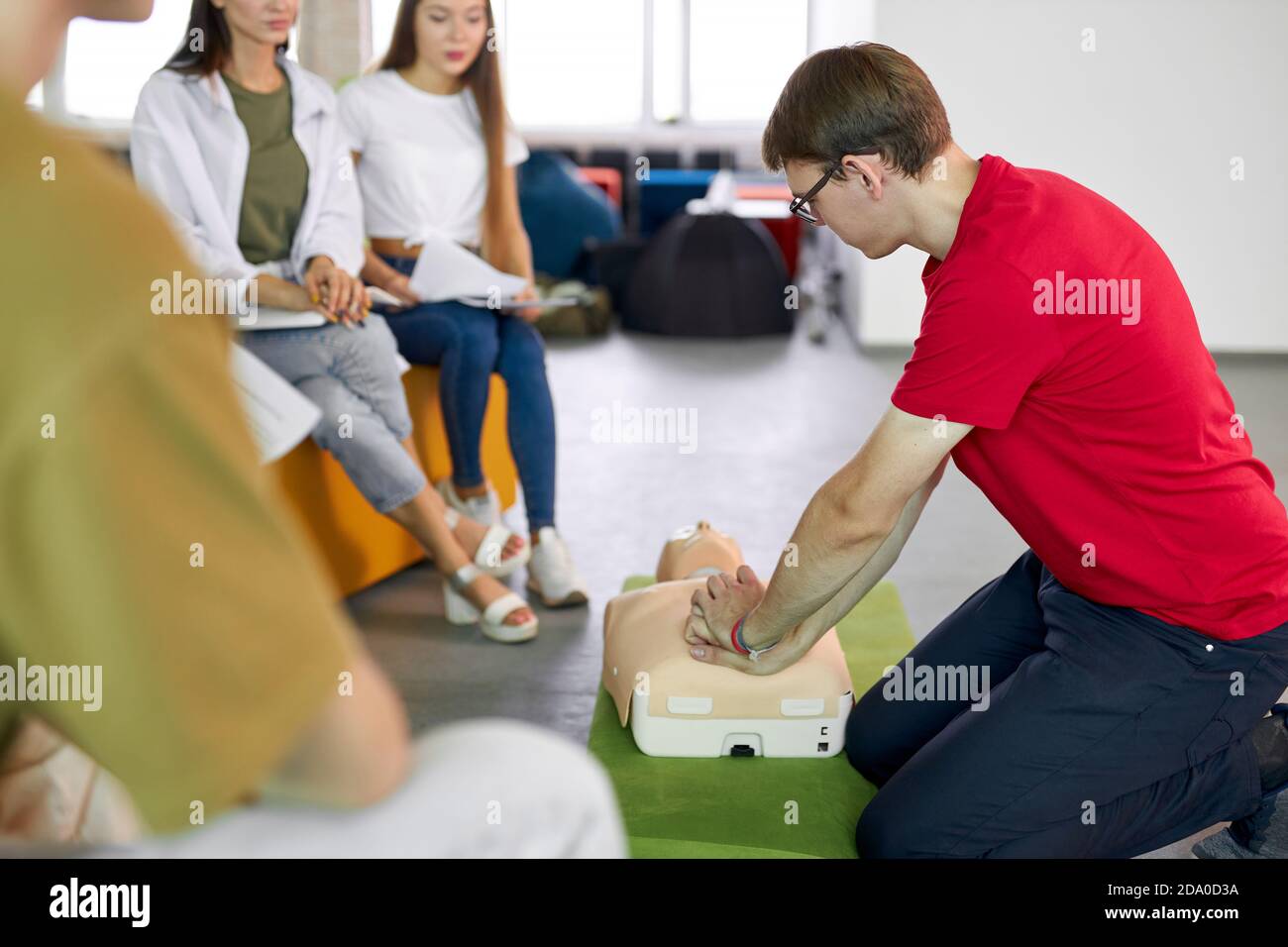 caucasian people practice an exercise of resuscitation during lesson ...
