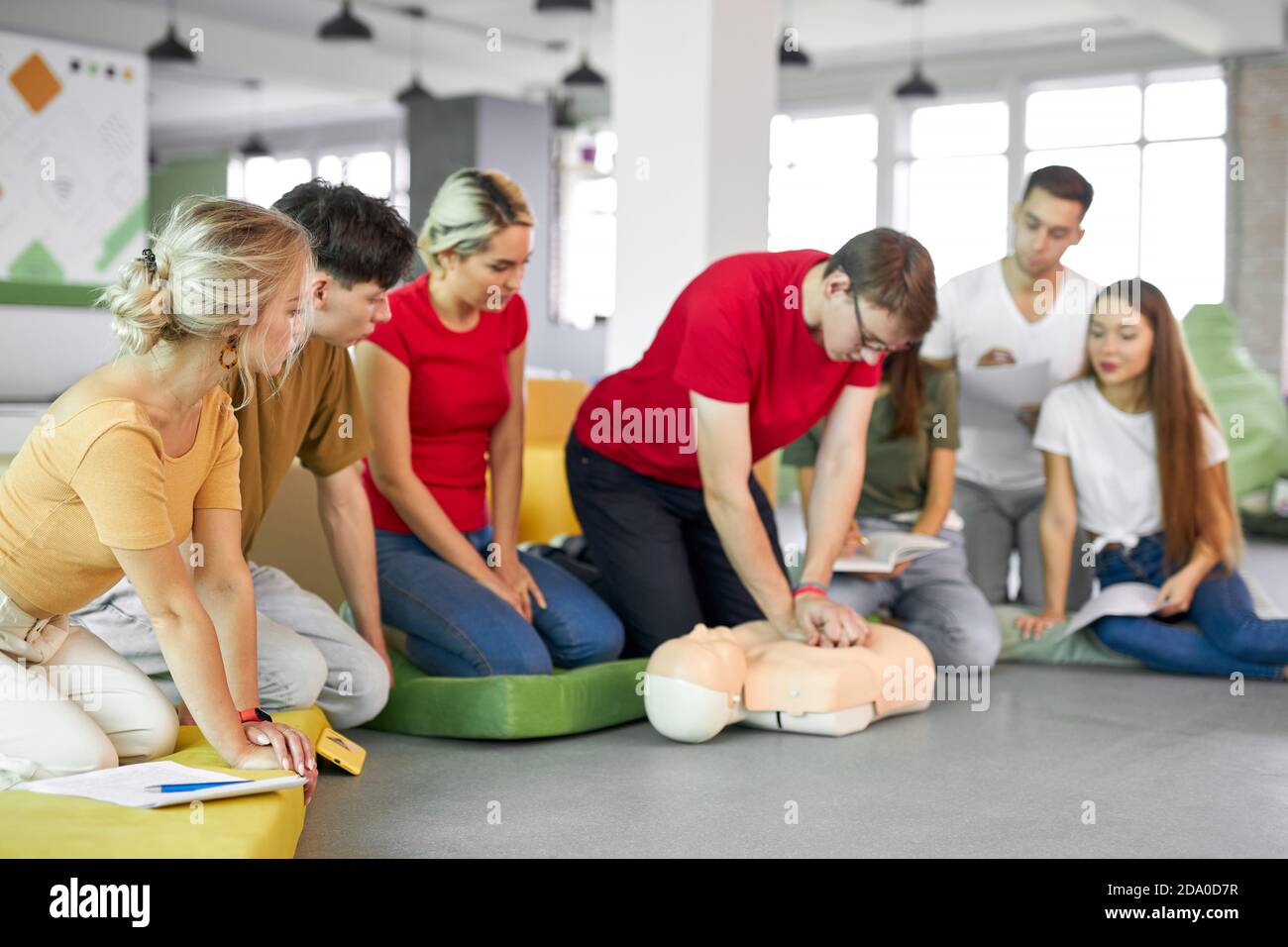 caucasian people practice an exercise of resuscitation during lesson ...