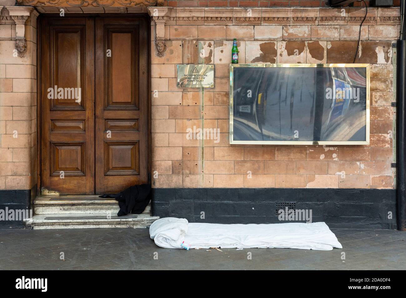 Mat and blanket of a rough sleeper outside the Palace Theatre during ...