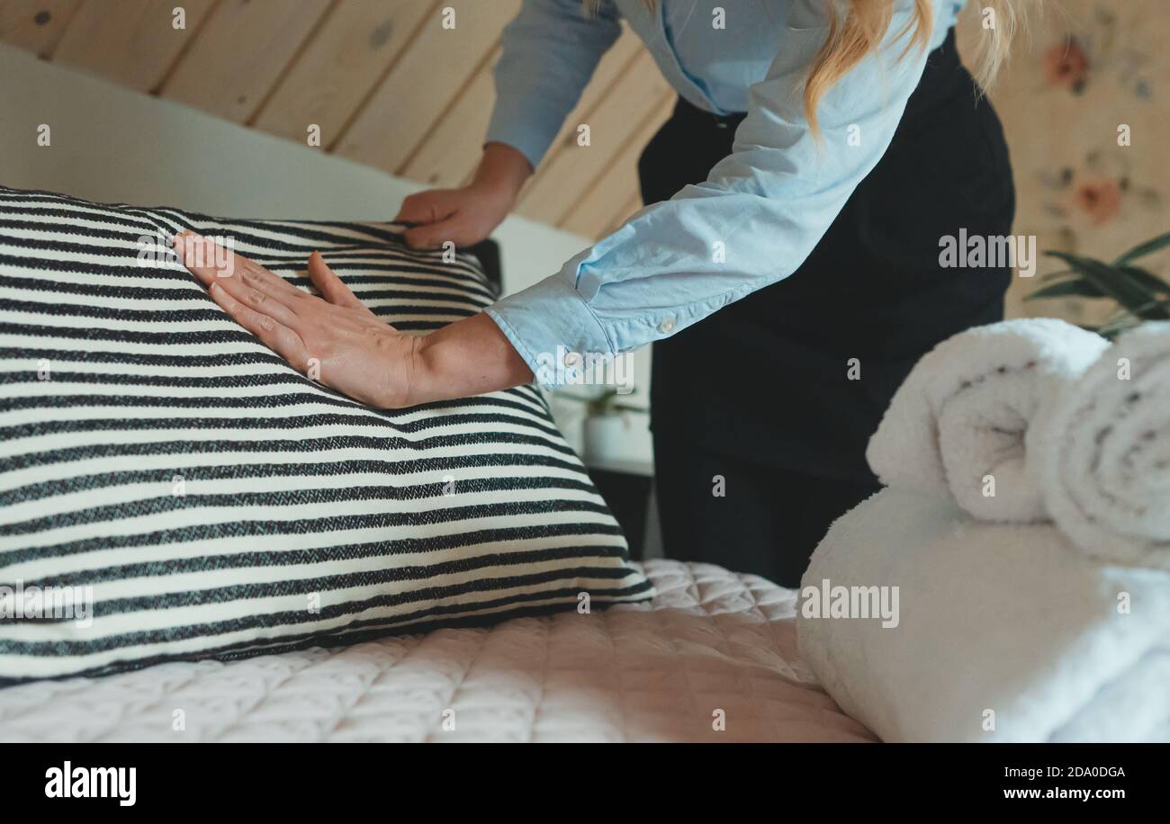 Room service. Woman making bed in hotel room Stock Photo - Alamy