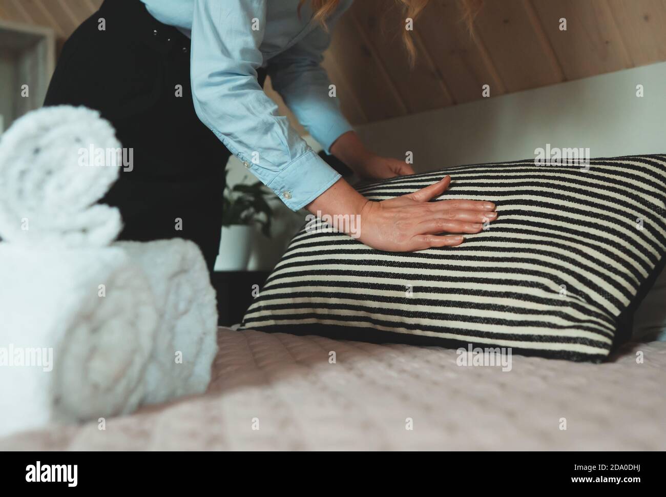 Room service. Woman making bed in hotel room Stock Photo - Alamy