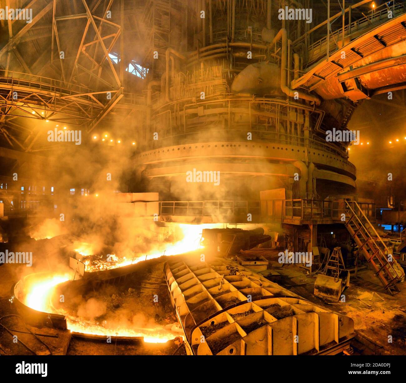 blast furnace iron tapping. Hot steel is poured into another pan Stock ...