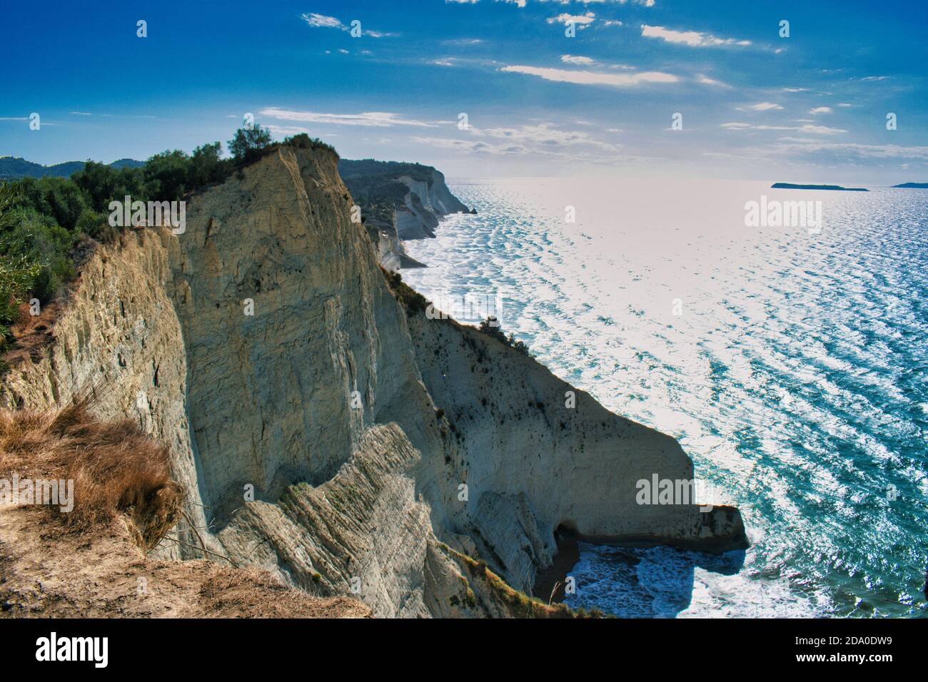 White cliff in Kerkyra Corfu Greece and heavenly blue sea in a bay with ...