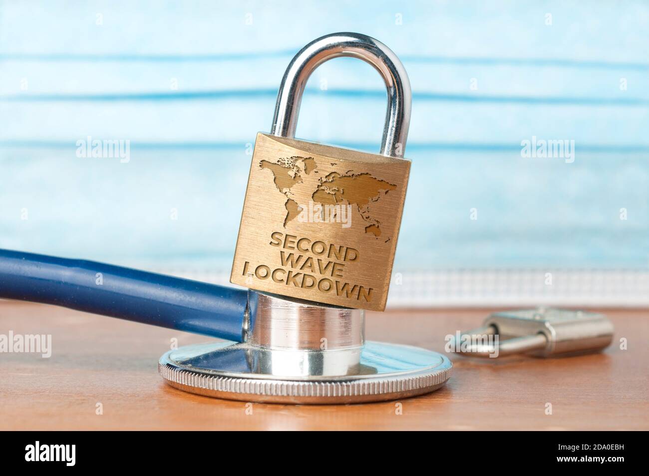 Covid-19 lockdown concept: a lock over a stethoscope with a surgical ...