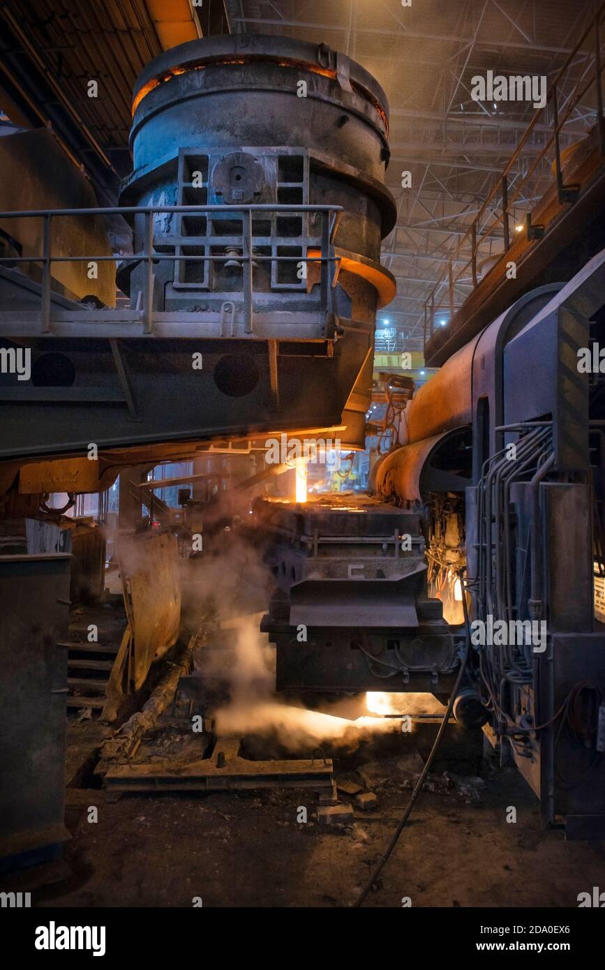 Steel production in electric furnaces. Sparks of molten steel. Electric ...