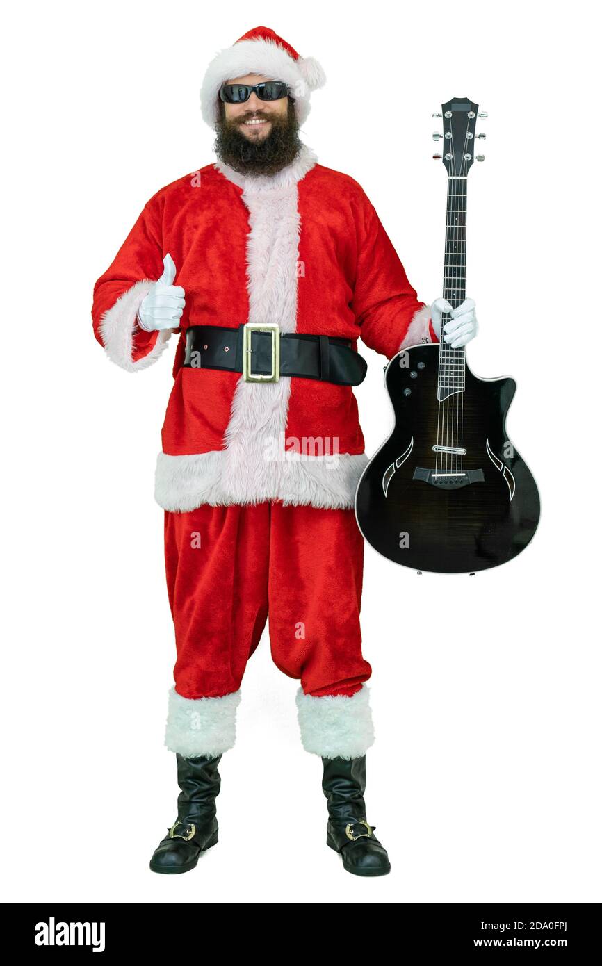 Santa holds guitar, smiles, shows thumb finger up. Santa Claus gutarist ...