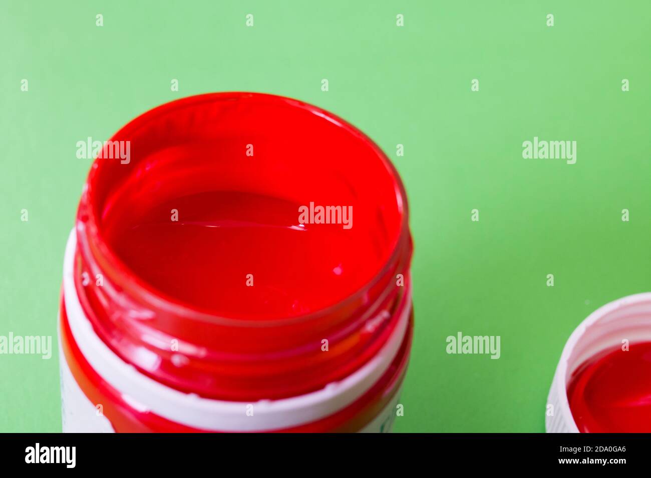 Open can with red paint close up Stock Photo - Alamy