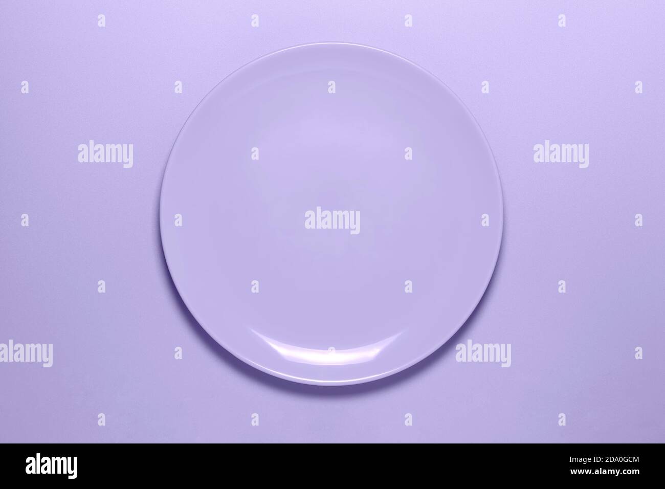 empty dish on matching color surface, top view Stock Photo - Alamy
