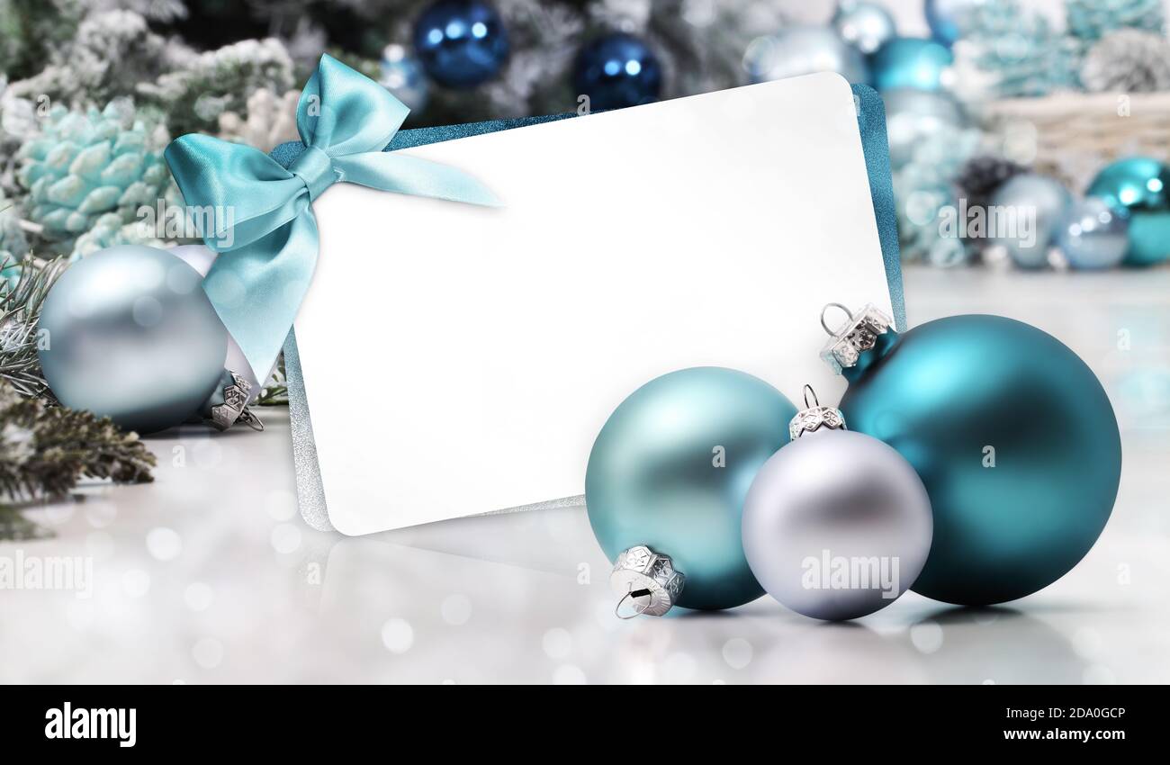 merry christmas gift card with bow and ribbon, next to blue Christmas ...