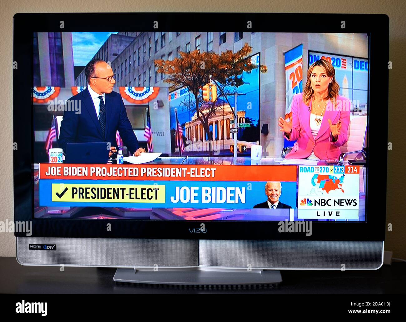 A TV screen grab of NBC news anchors reporting that Joe Biden has been ...