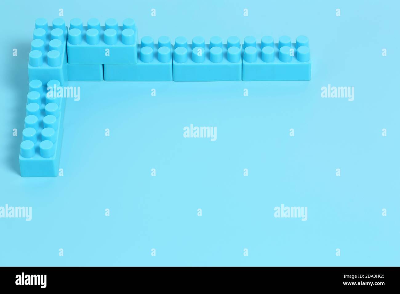 blue toy blocks on similar color surface with copy space Stock Photo ...