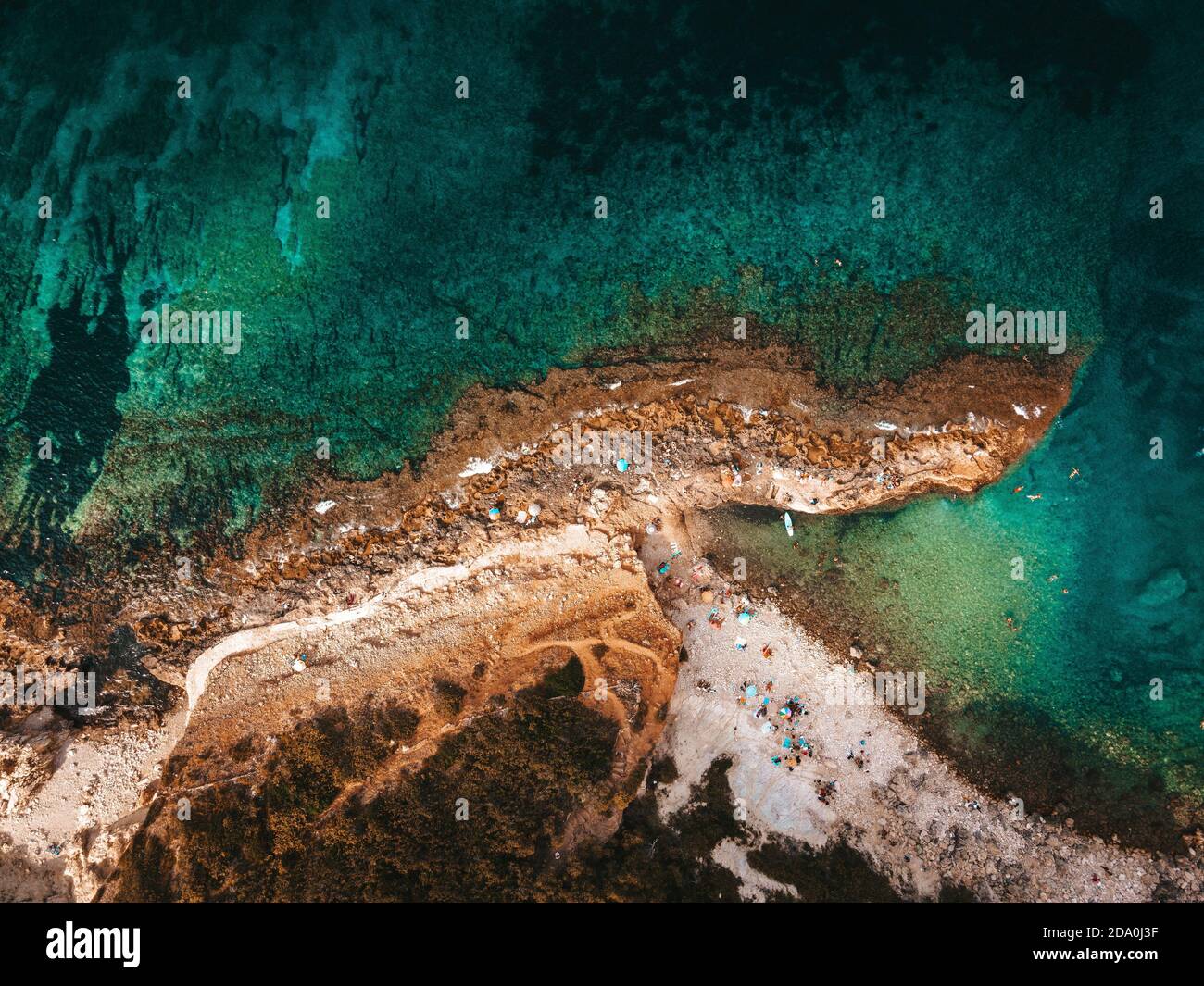 Aerial view of majestic rough sandy coastline and calm sea with ...