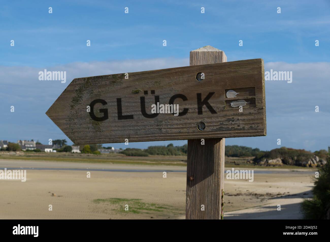 A billboard pointing in the direction of happiness Stock Photo - Alamy