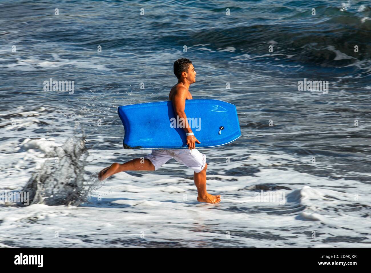 Surfers at Beach with black sand on Pointe Venus, Tahiti, French ...