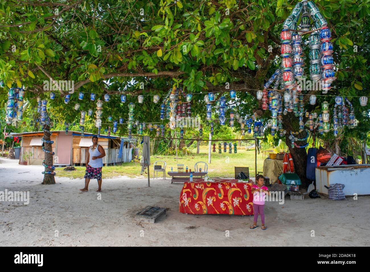 Local vendor at beach of motu Tevairoa island, a little islet in the ...