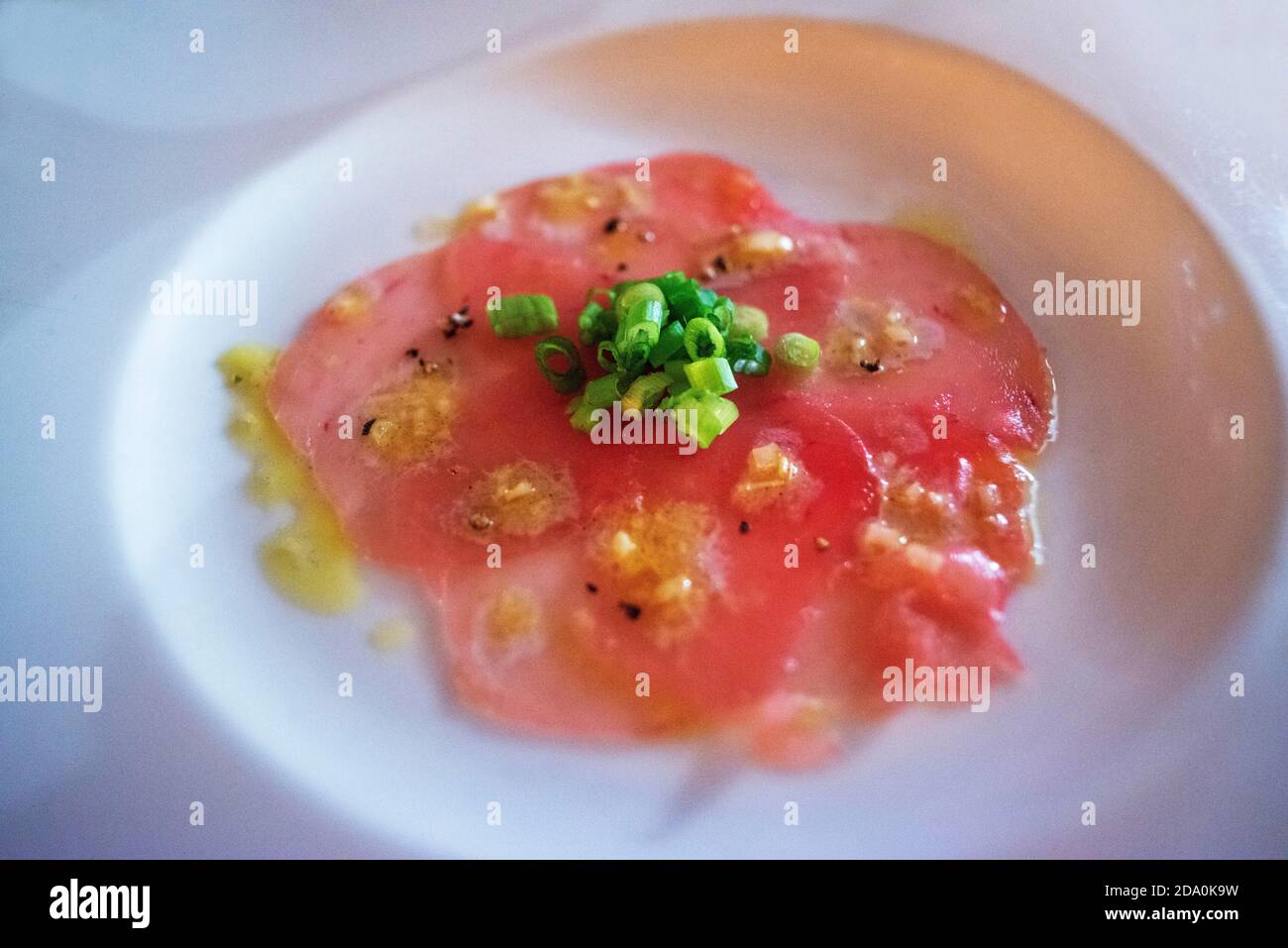 Beef carpaccio served in the restaurant of the luxury Paul Gauguin ...