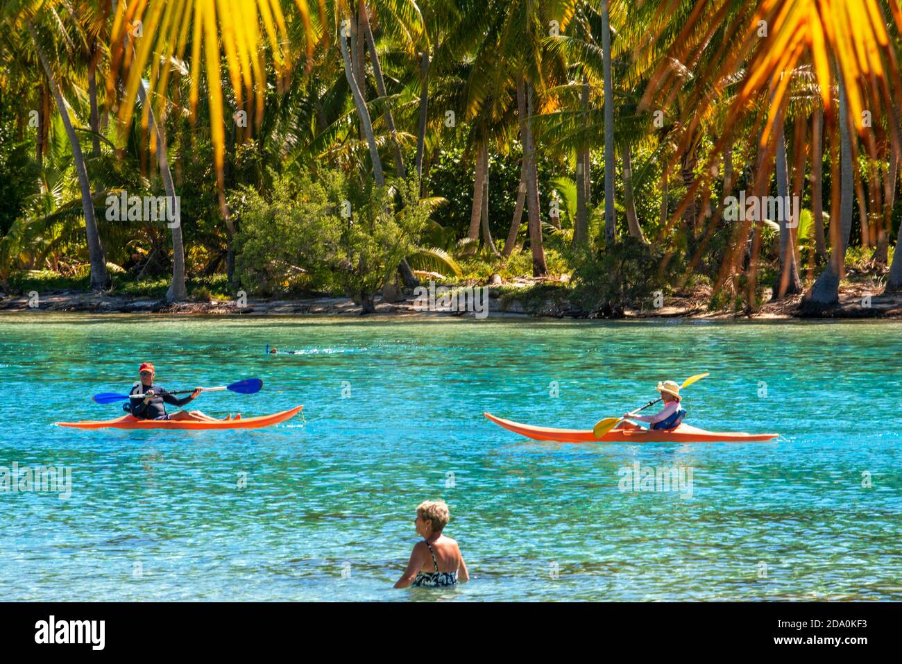Kayaking in Taha'a island beach, French Polynesia. Motu Mahana palm ...