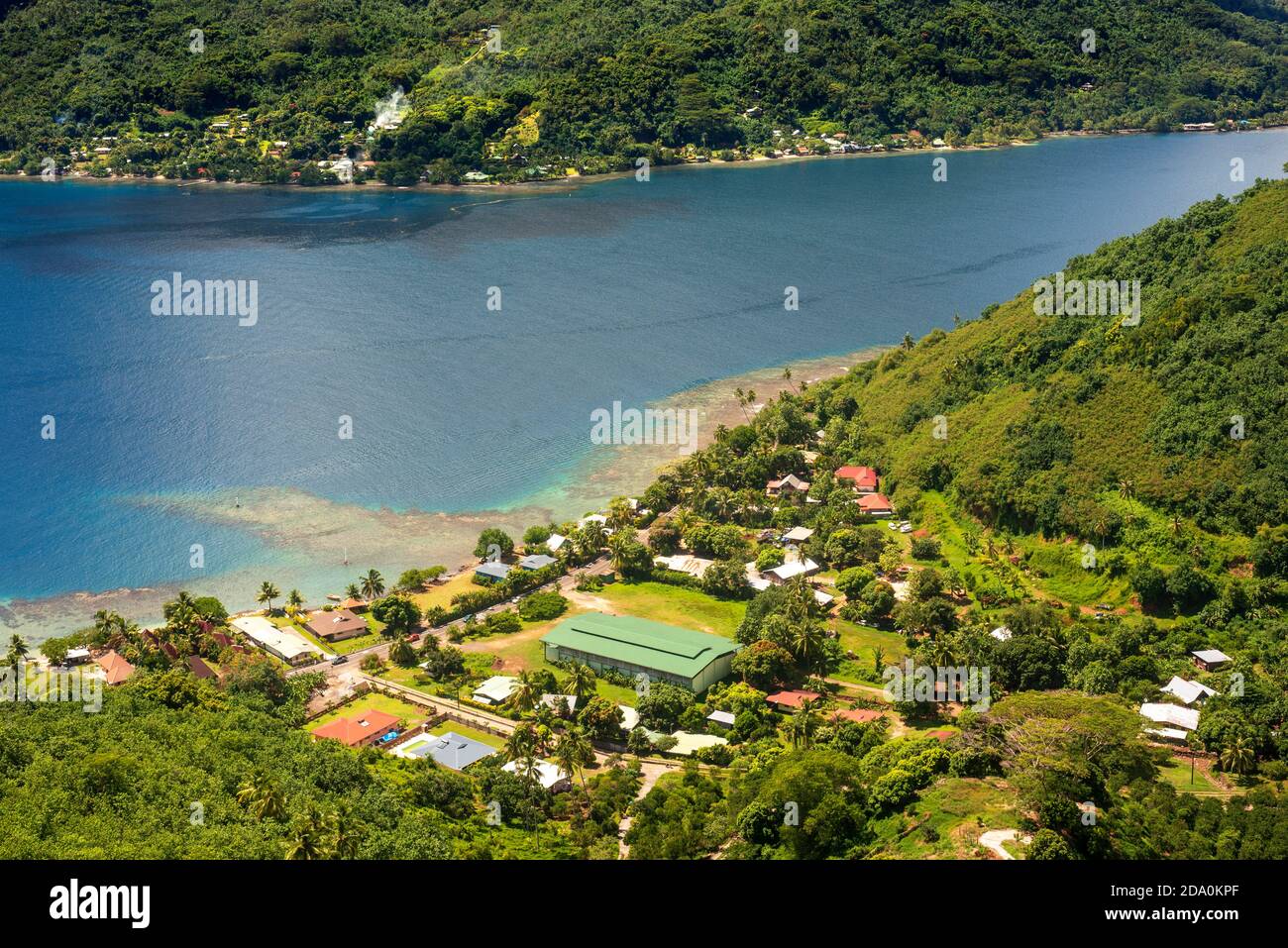 Typical houses, road, and reef see, Moorea island (aerial view ...