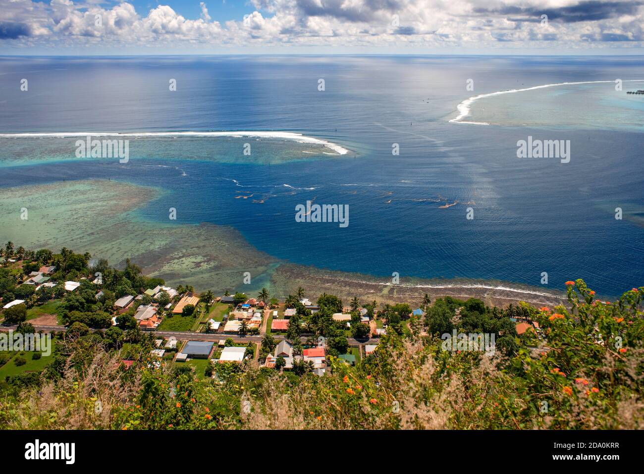 Typical houses, road, and reef see, Moorea island (aerial view ...
