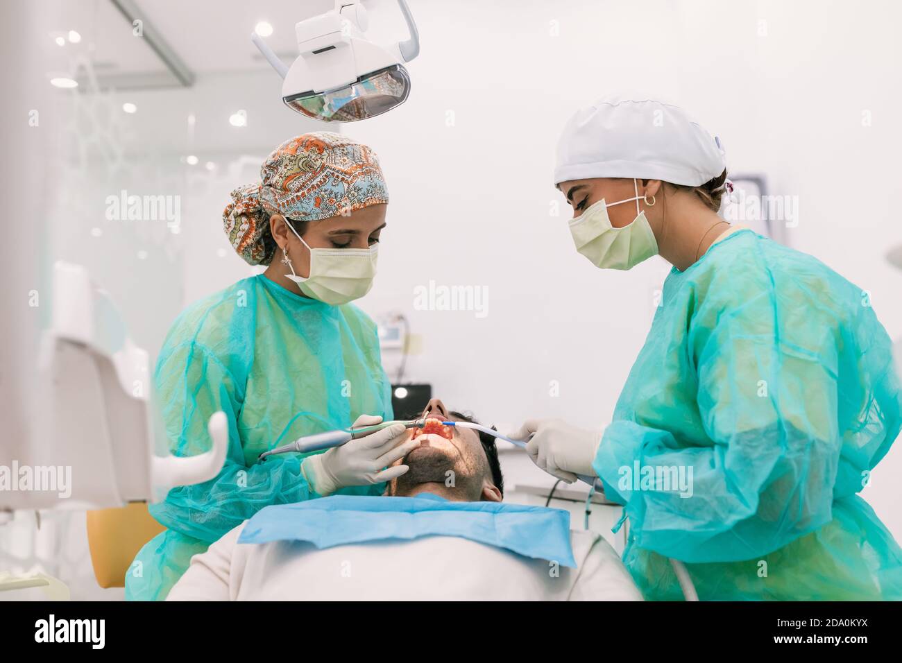 Young Female patient with open mouth examining dental inspection Stock ...