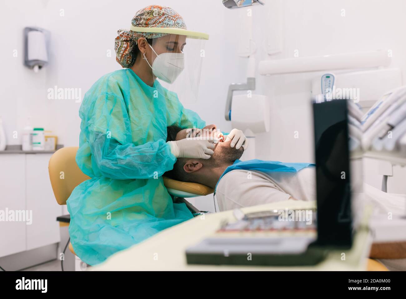 Young Female patient with open mouth examining dental inspection Stock ...