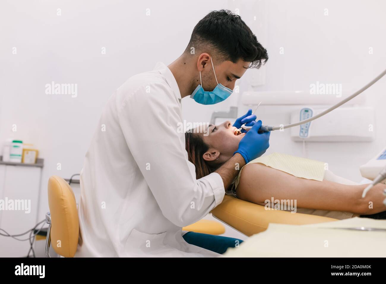 Young Female patient with open mouth examining dental inspection Stock ...