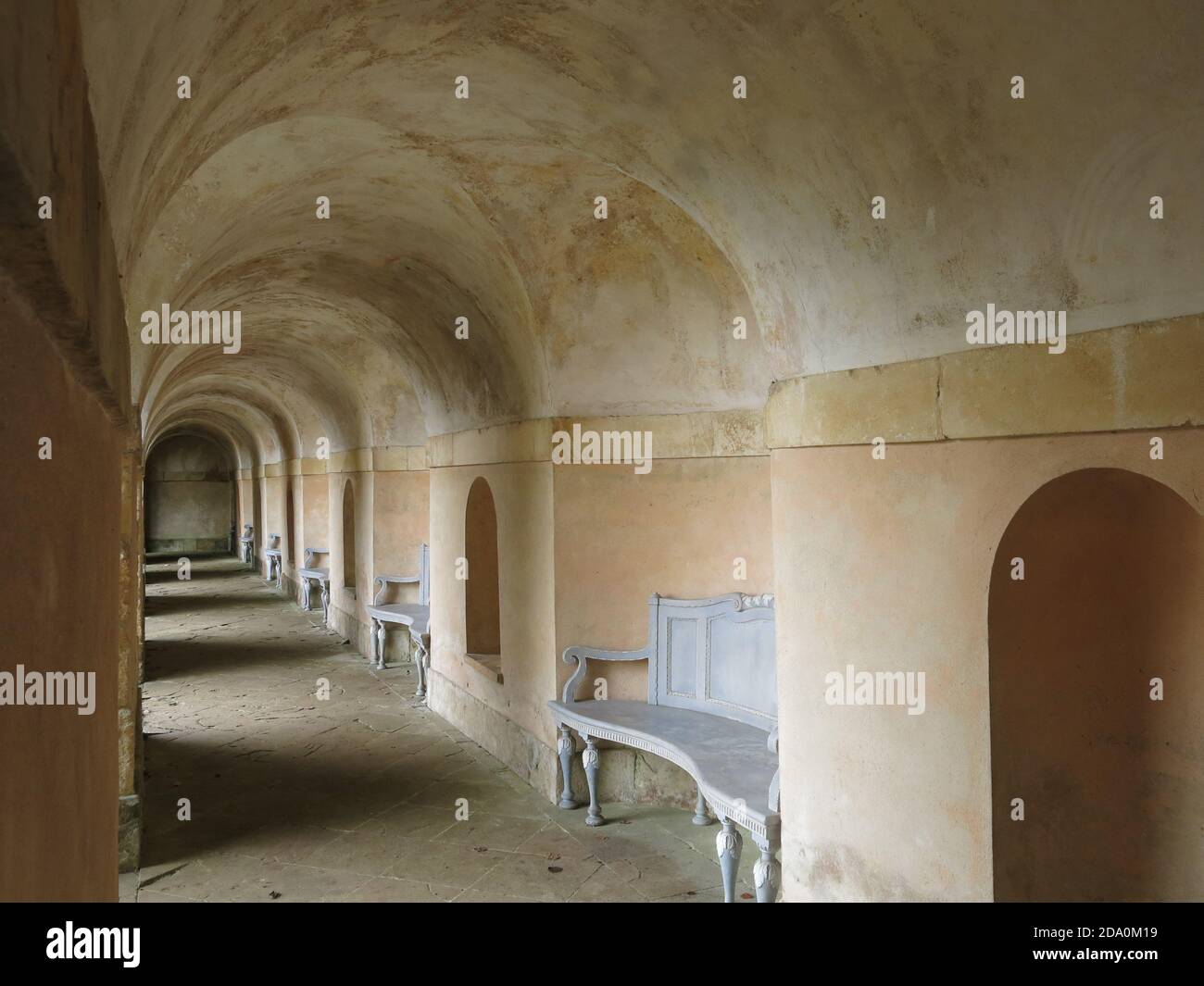 The arched arcade with seating in alcoves along its length; a feature ...